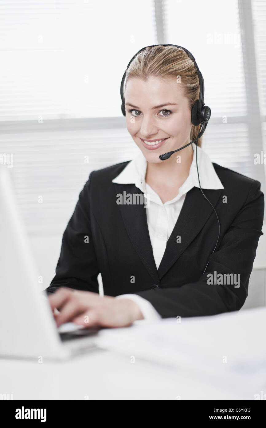 Technical people working laptop headset hi-res stock photography and ...