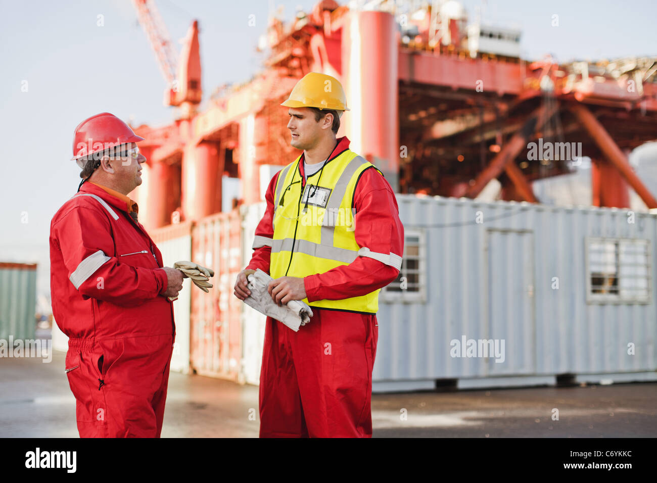 Three young oil rig workers hi-res stock photography and images - Alamy
