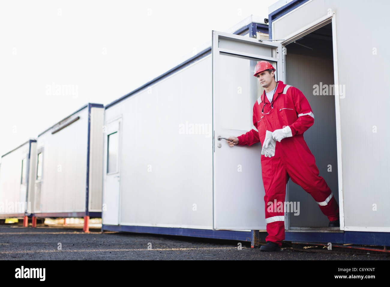 Worker exiting trailer Stock Photo - Alamy