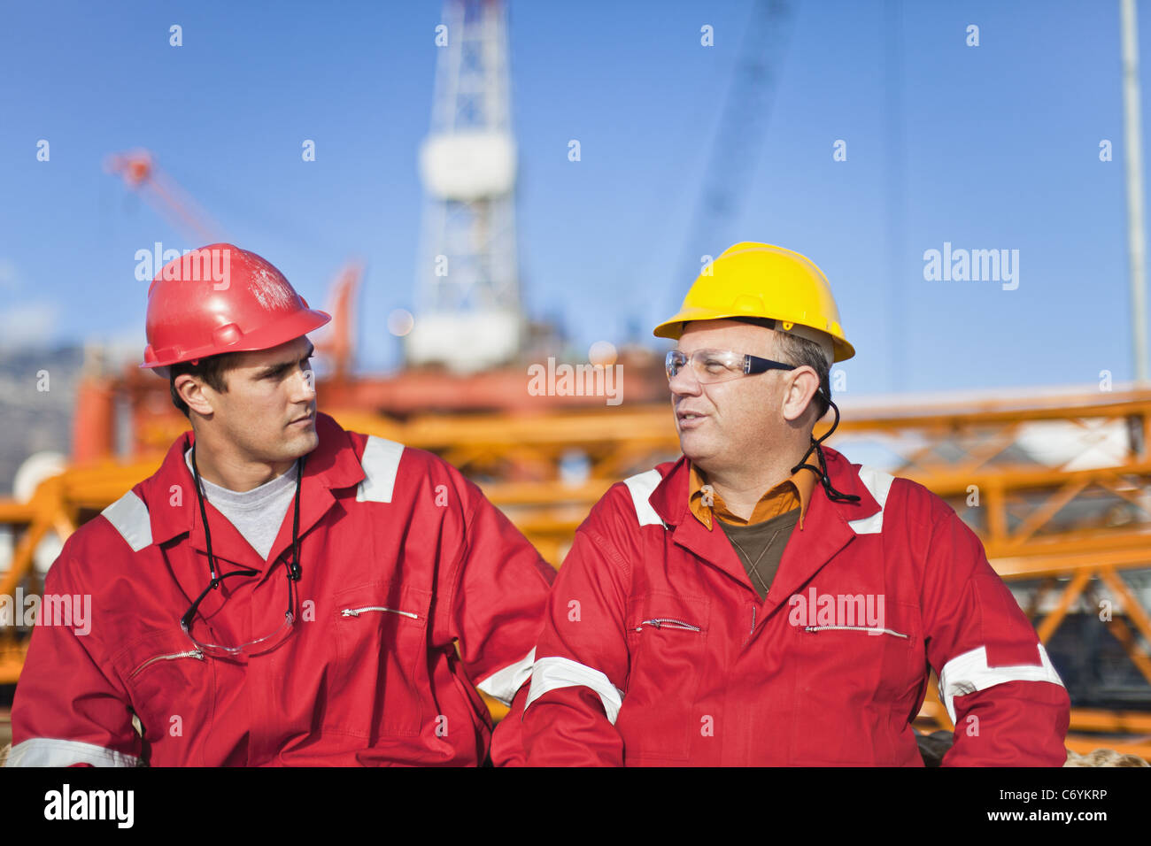 Workers talking on oil rig hi-res stock photography and images - Alamy