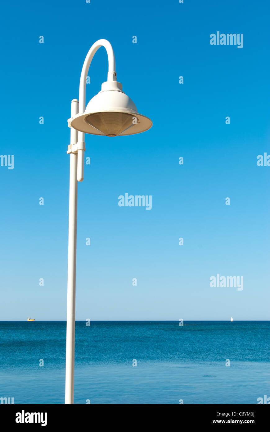 Classic white street light on a Mediterranean promenade Stock Photo - Alamy
