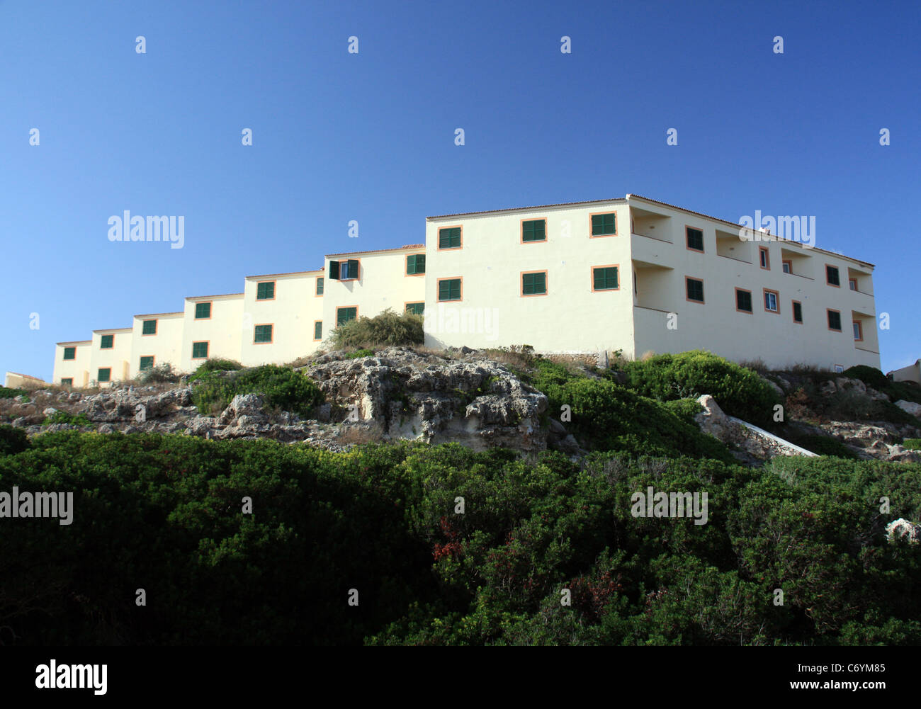 A set of apartment buildings on a hill in Menorca Stock Photo - Alamy