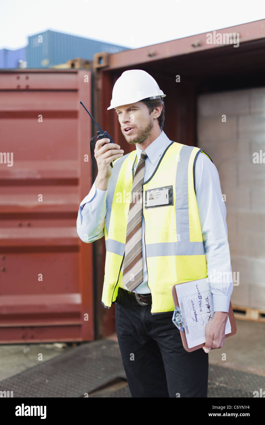 Worker using walkie talkie on site Stock Photo - Alamy