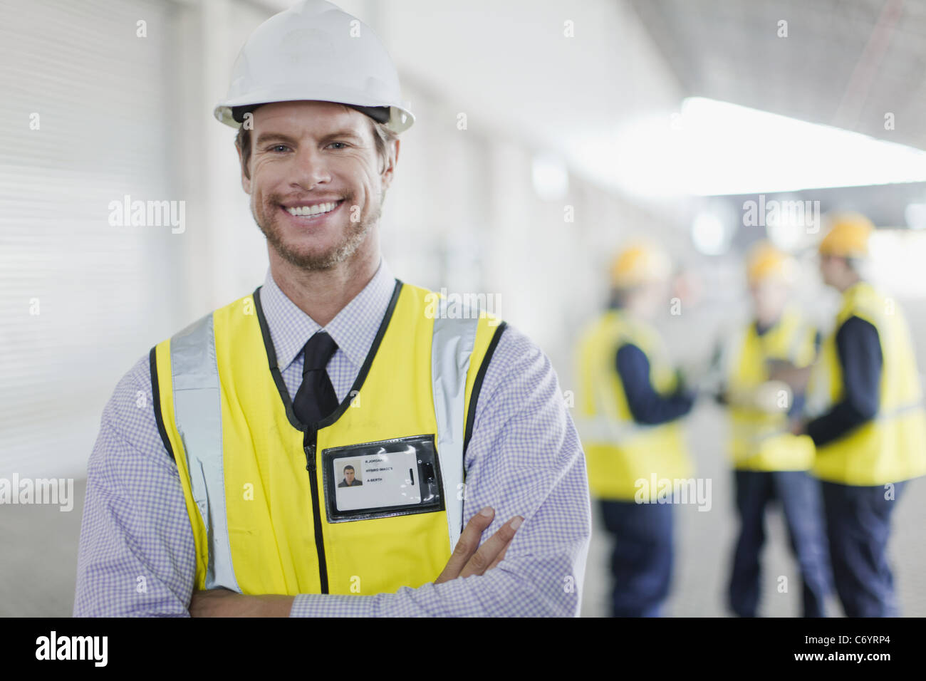 Worker standing in warehouse Stock Photo - Alamy
