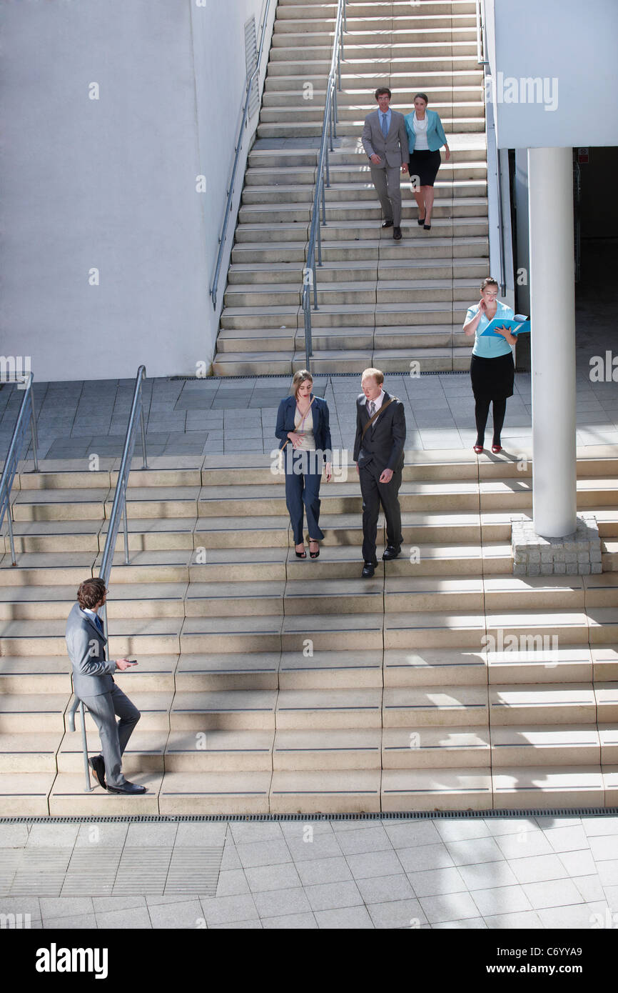 Business people walking on steps Stock Photo - Alamy