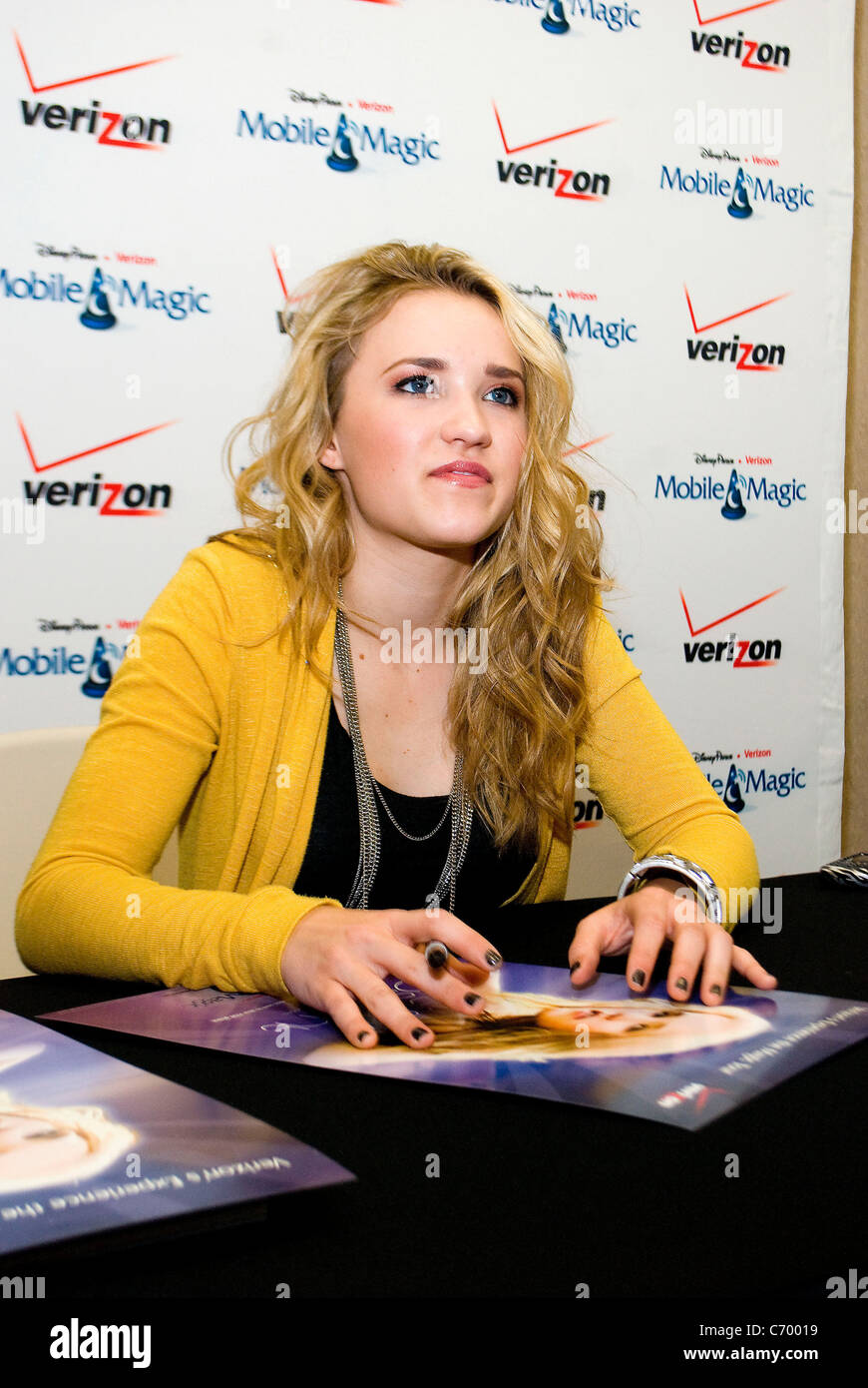 Emily Osment signs autographs whilst appearing on Verizon's Experience ...