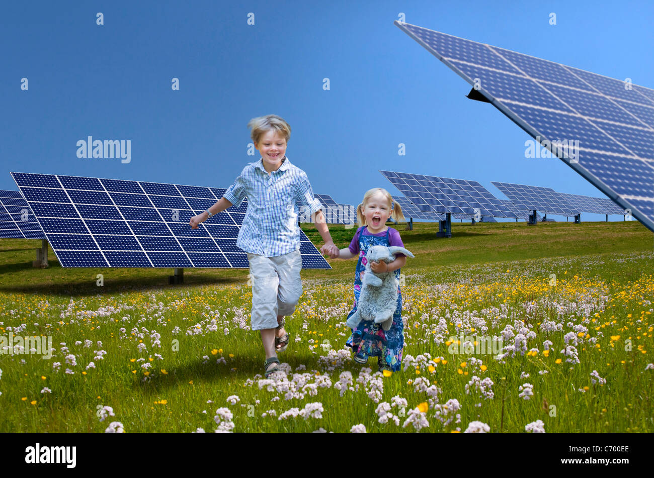 Children playing near solar panels Stock Photo: 38723734 - Alamy