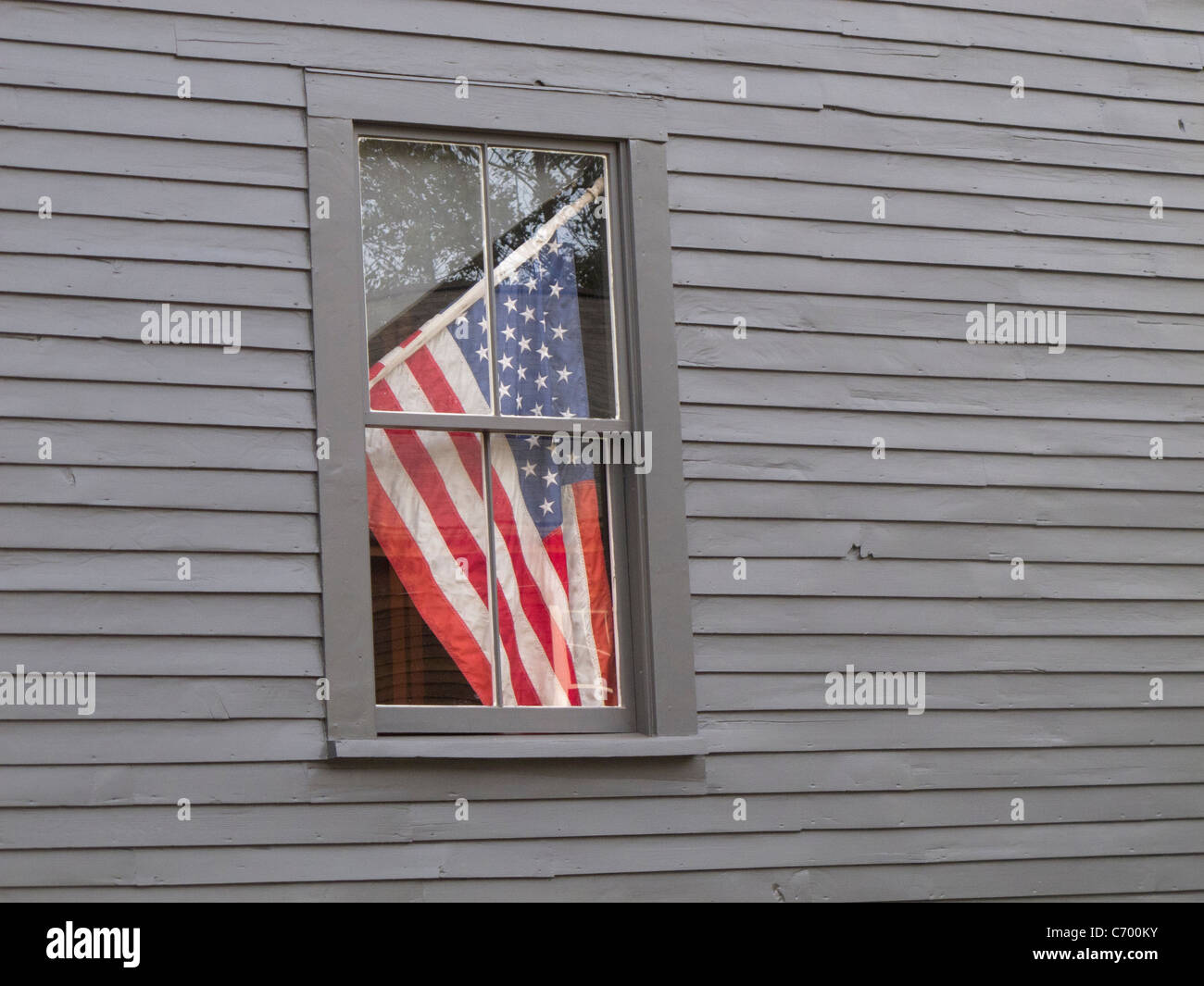 American flag in house window Stock Photo - Alamy