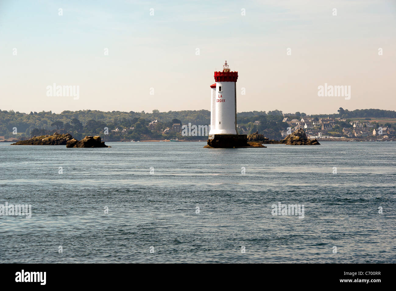 The distinctive red-topped white double tower of La Croix lighthouse on ...