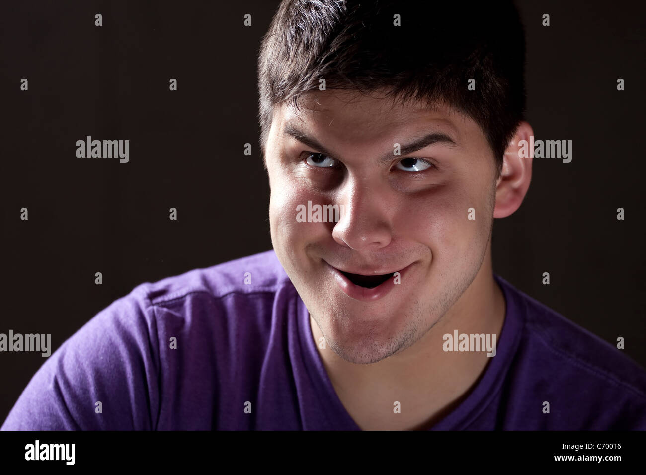 A young man goofing around with a funny expression on his face Stock ...