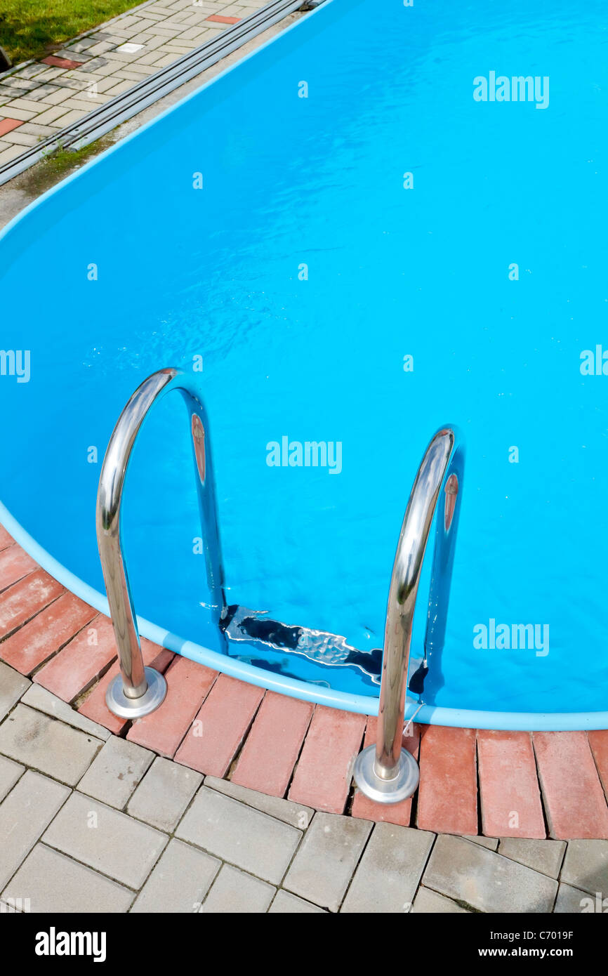 Metal swimming pool steps Stock Photo - Alamy