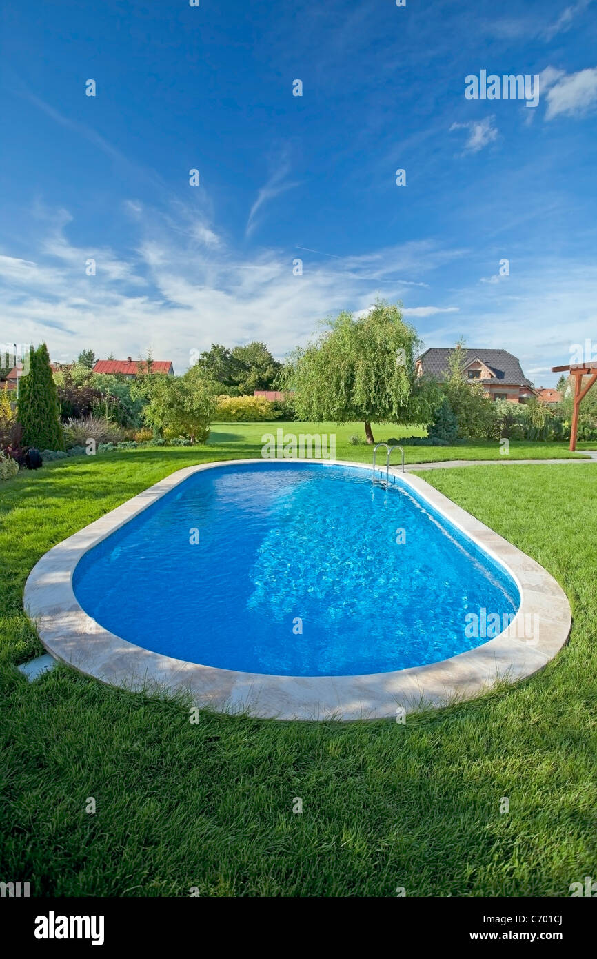 The pool with the garden at afternoon sunshine Stock Photo - Alamy