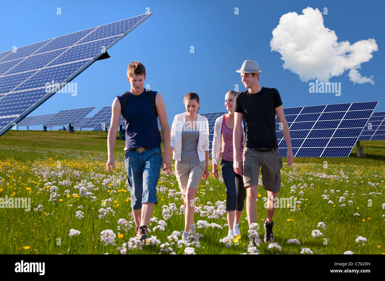 People walking by solar panels Stock Photo - Alamy