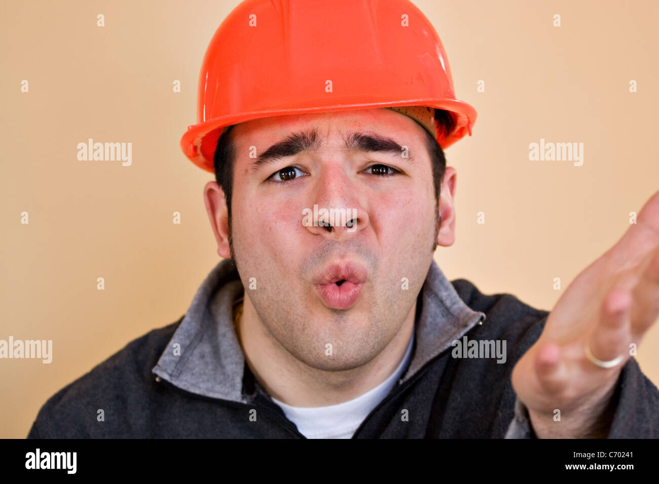 This construction worker is frustrated and confused about something ...