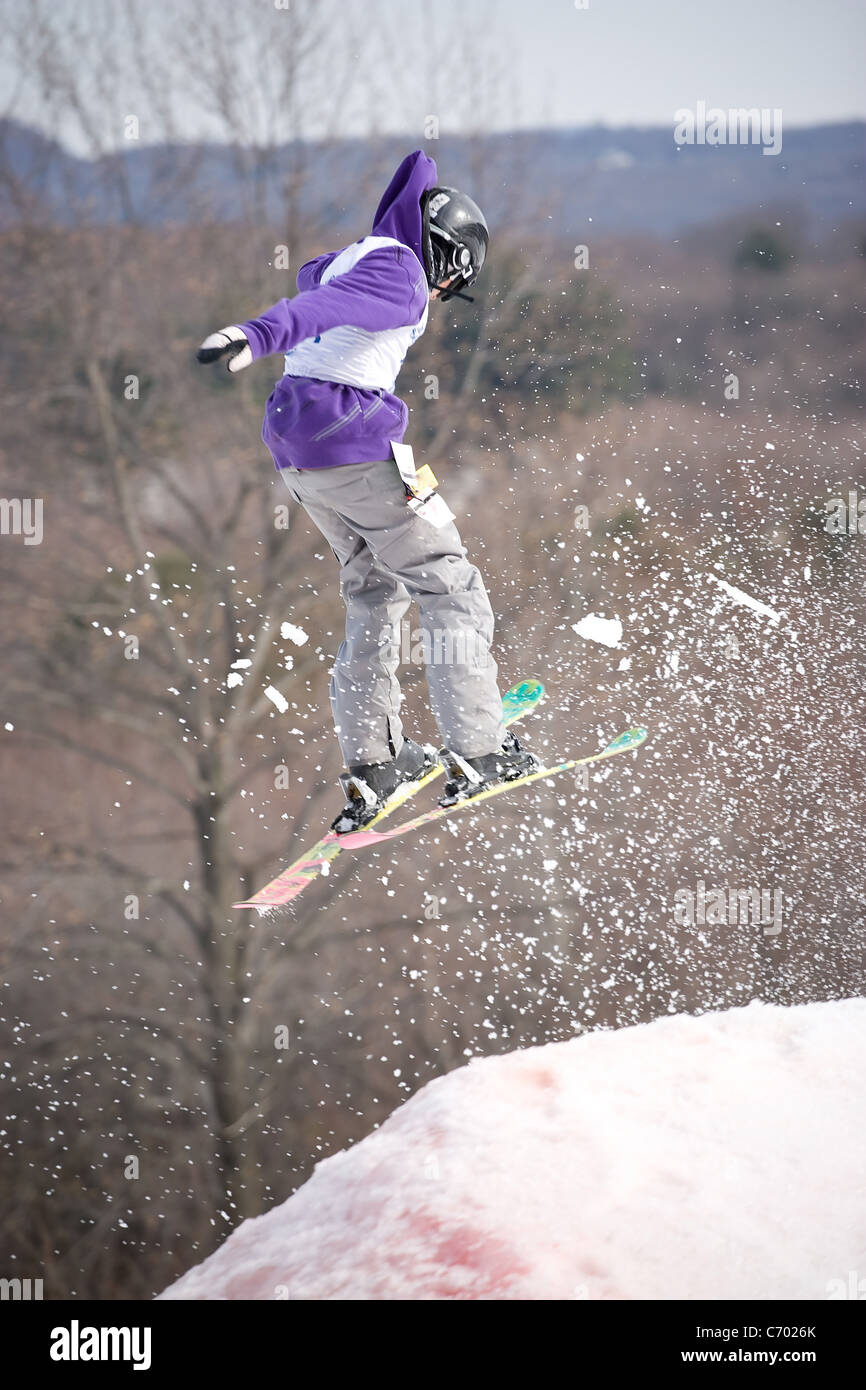 A skier catching some major air after launching off of a jump Stock ...