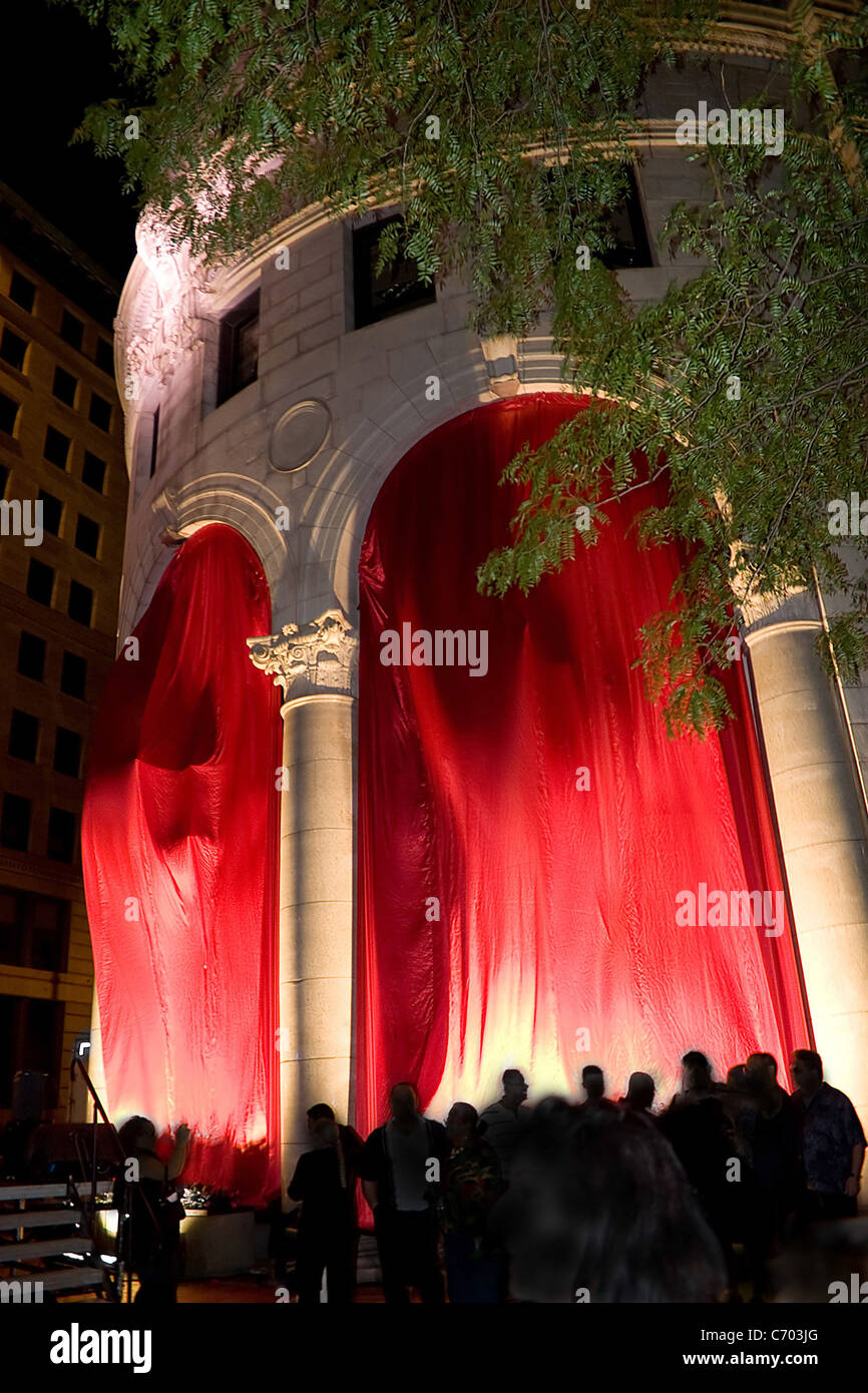 Classic architecture with flowing red curtains. The silhouettes of the ...