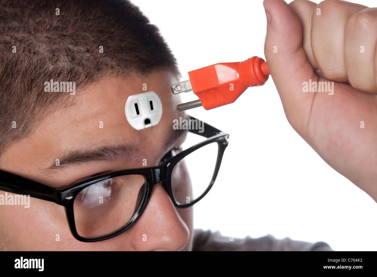 Conceptual image of a young man holding an electrical chord unplugged ...