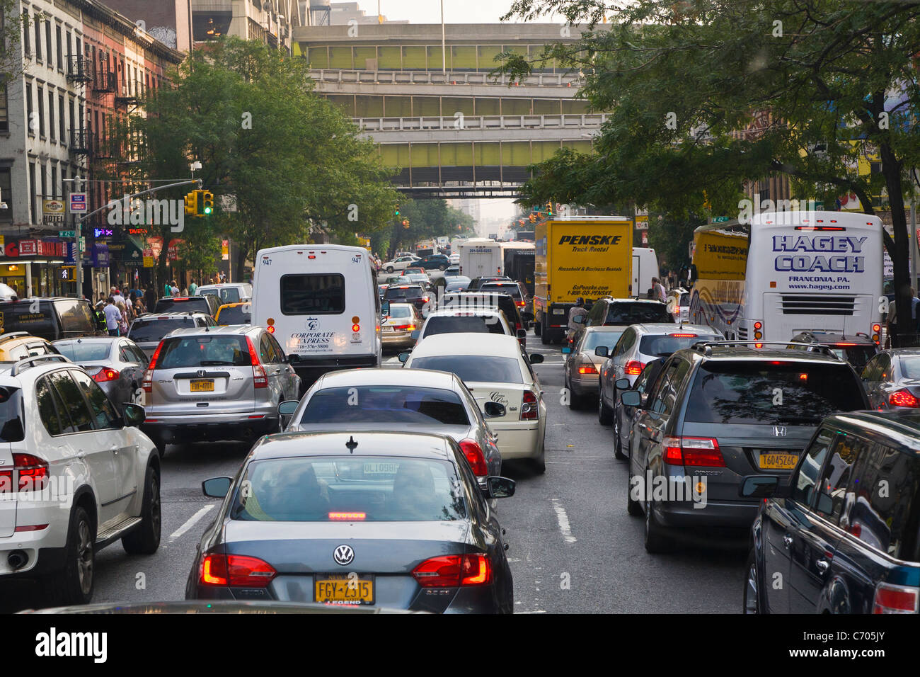 Traffic and pedestrians on crowded city streets in Manhattan in New ...