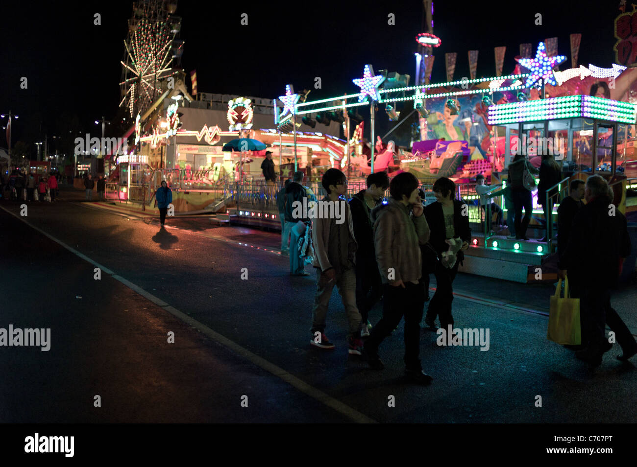 group of Asian youths smoking, at fair ground Stock Photo - Alamy