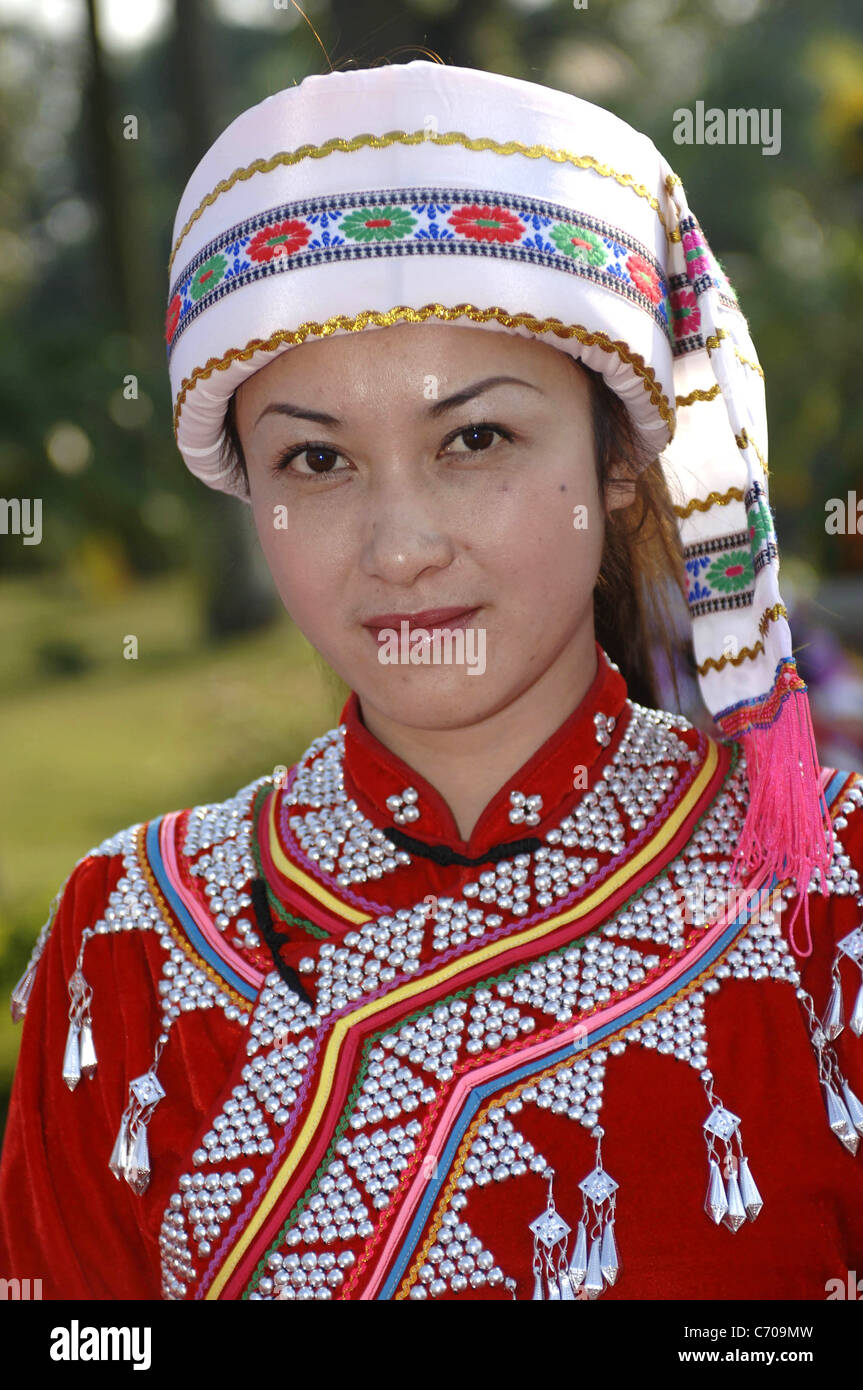 Li Li of the Lahu ethnic minority displaying her folk costumes in ...