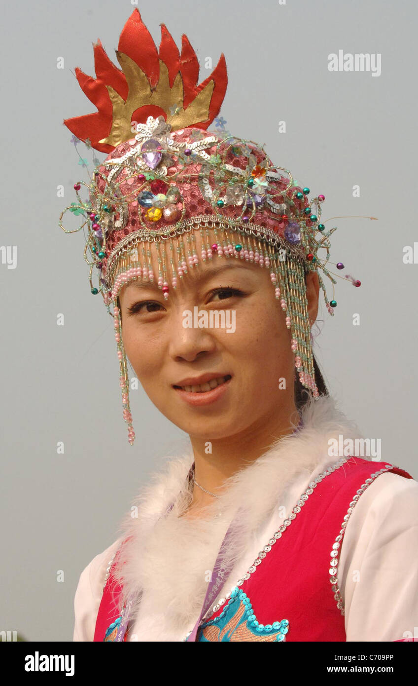 Fu Lina of the Xibe ethnic minority displays her folk costumes at a ...