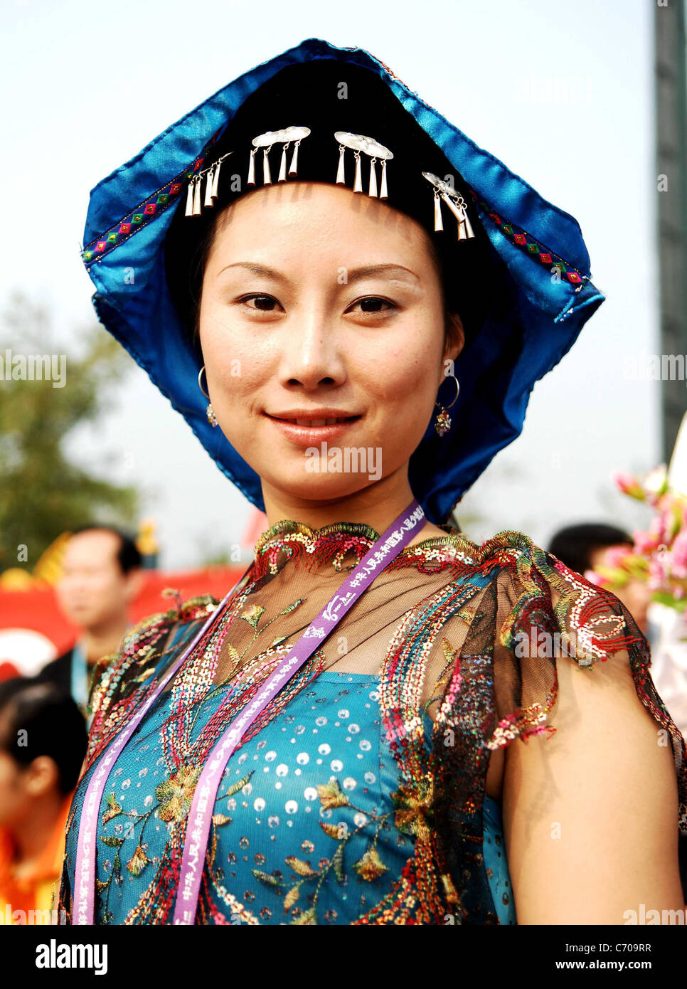 Luo Xin of the Gelao ethnic minority displays her costumes at a grand ...