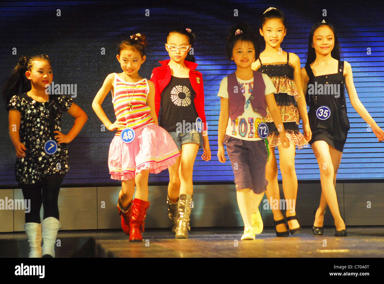 Kids model perform their show during a children's modelling contest in ...