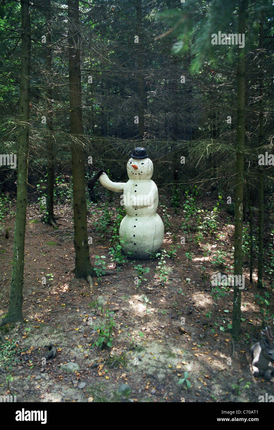 Plastic snowman in forest Stock Photo - Alamy