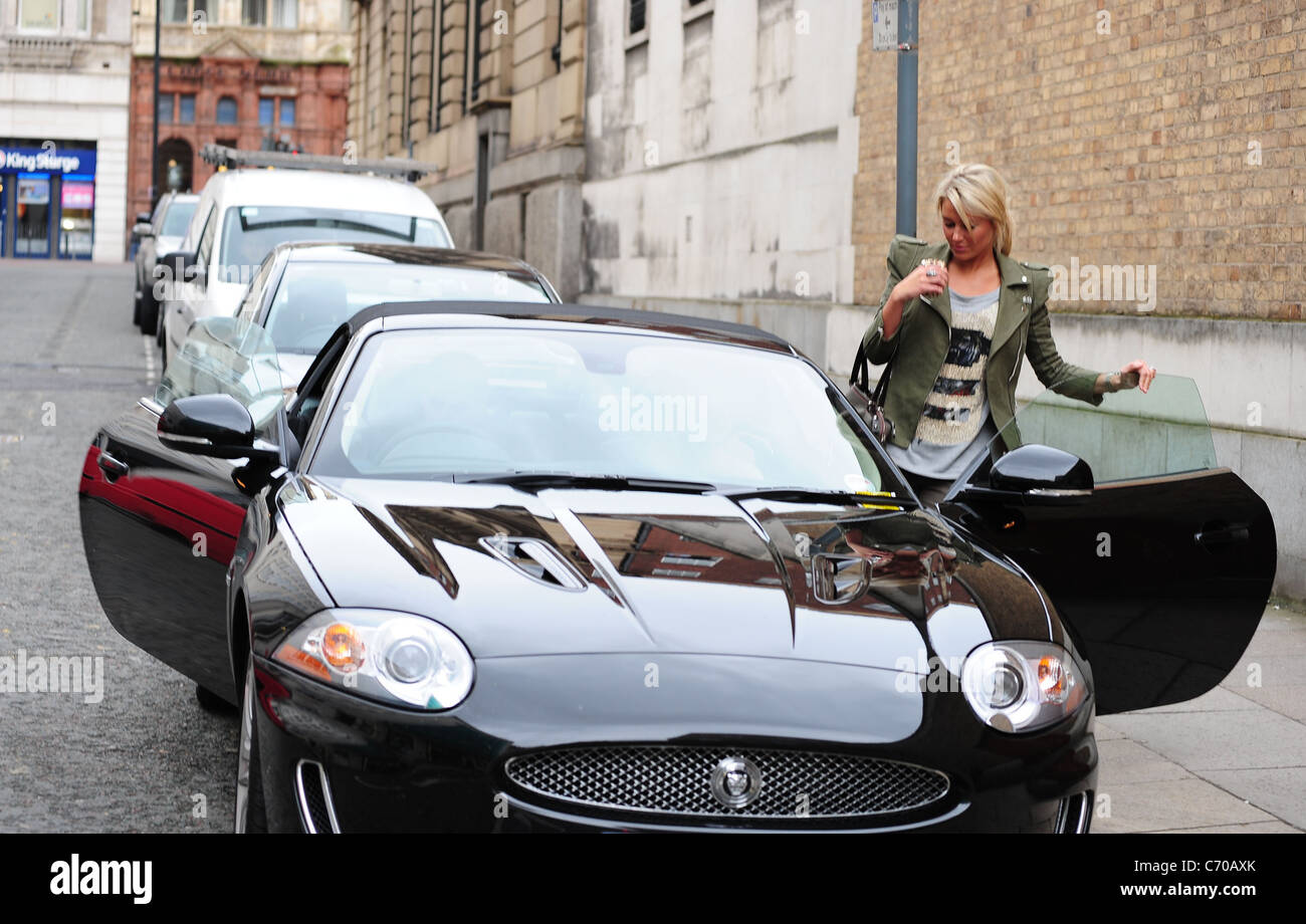 Steven Gerrard and Alex Curran return to their vehicle after the ...