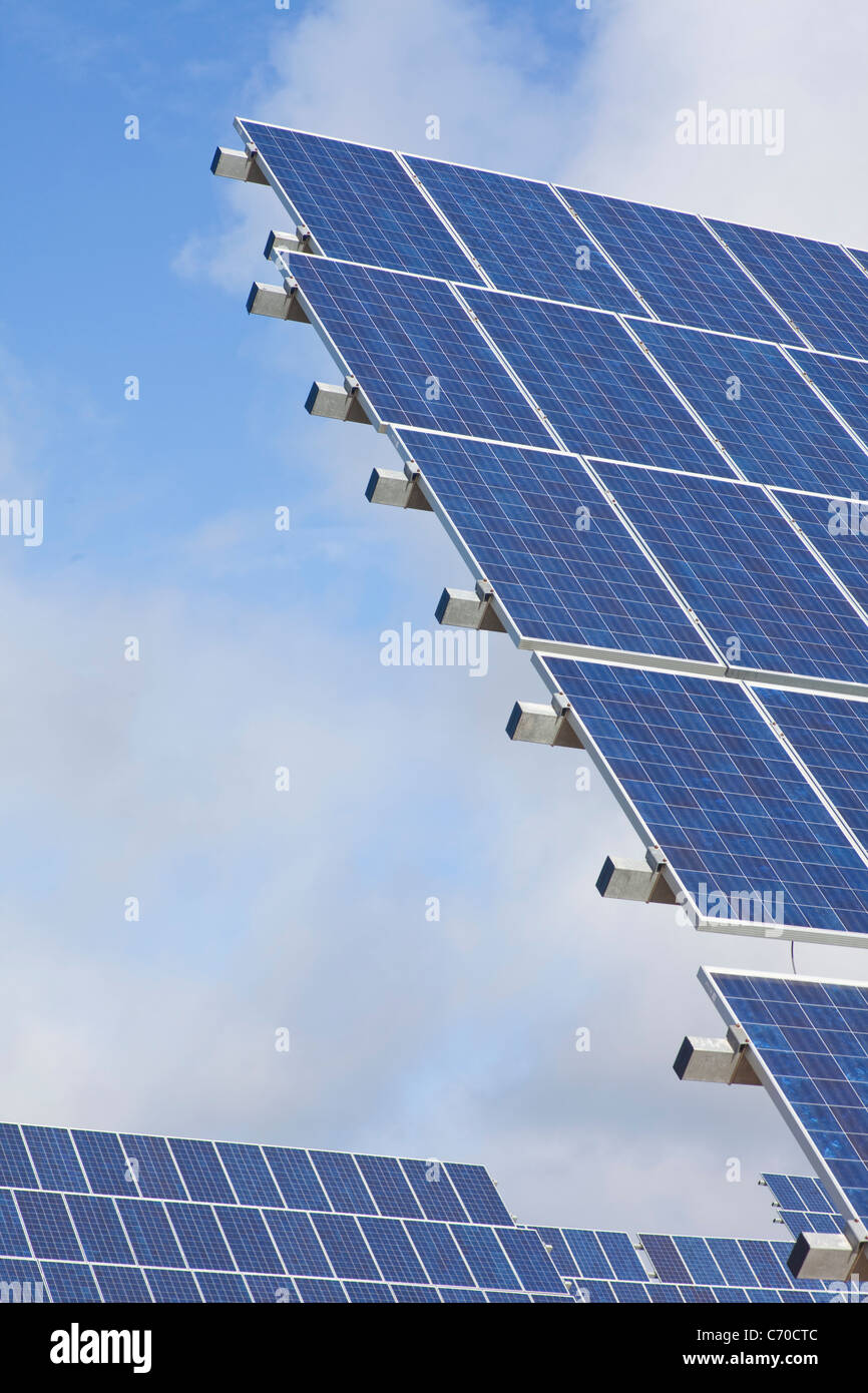 Solar panels against blue sky Stock Photo - Alamy