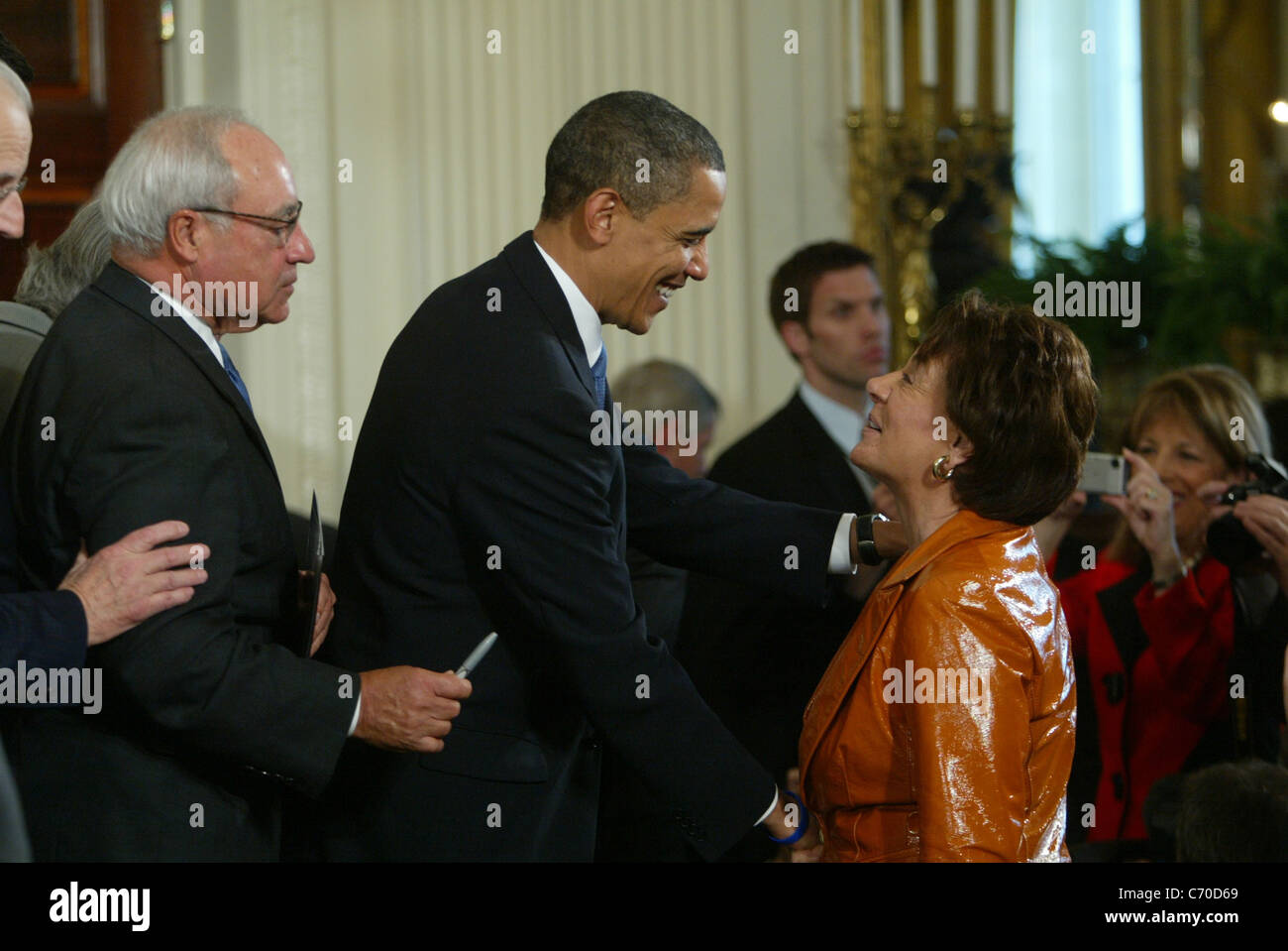 President Barack Obama signs the health insurance reform bill in the ...