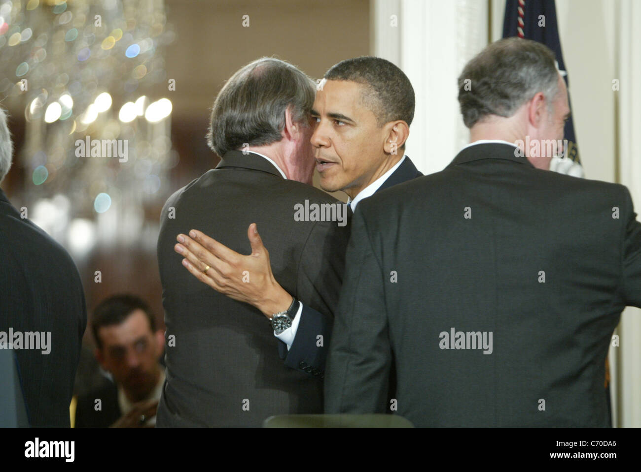 Congressional supporters congratulating President Obama after signing ...