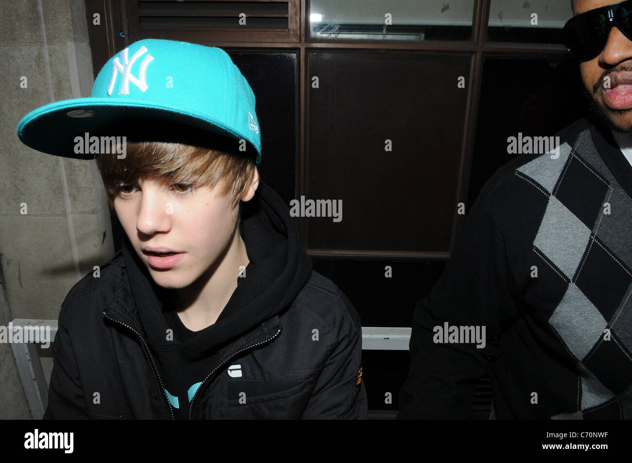 Justin bieber signing autographs outside the radio one studios london ...