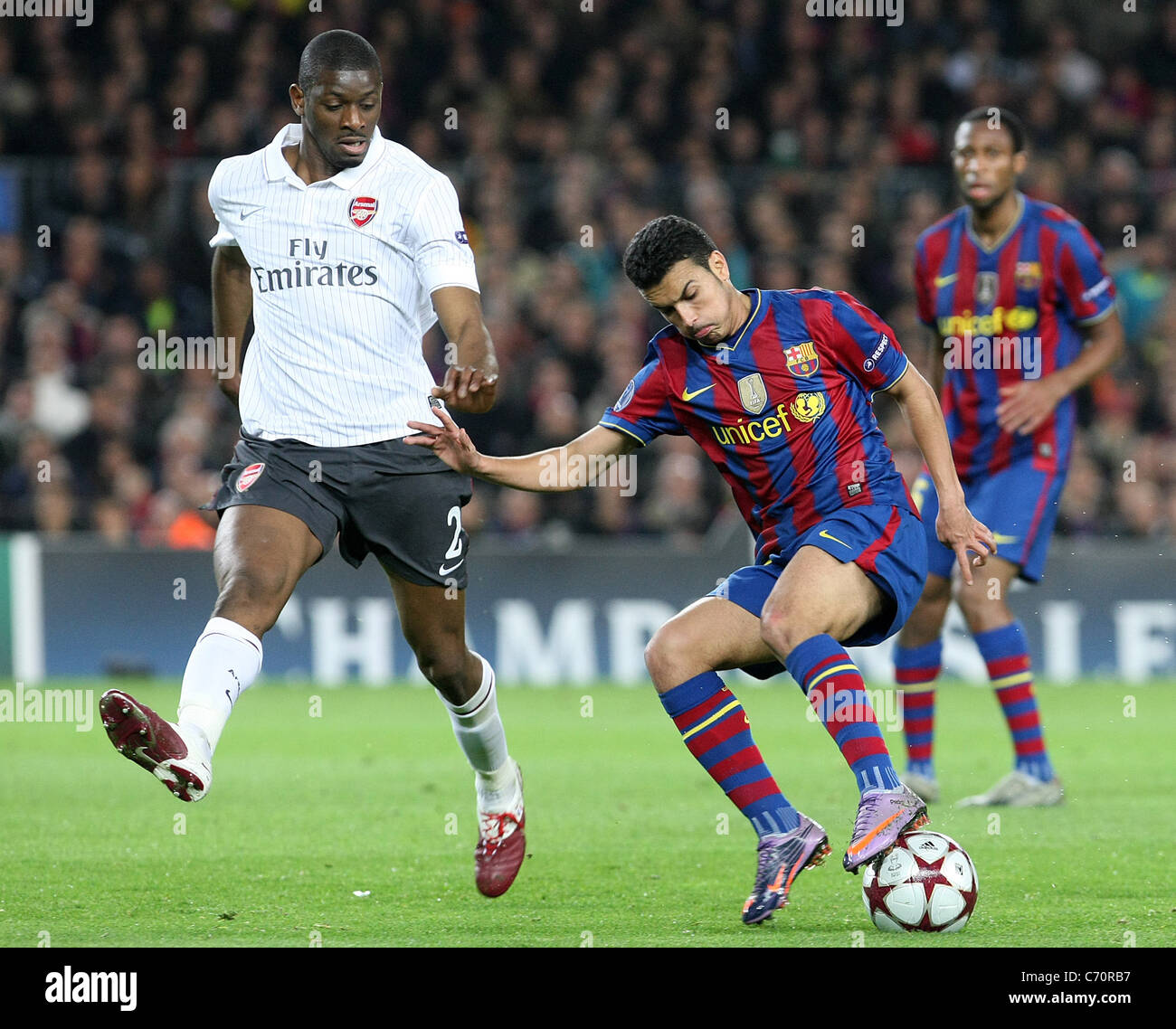 FC Barcelona's Pedro Rodriguez (r) and Arsenal's Abou Diaby during the ...