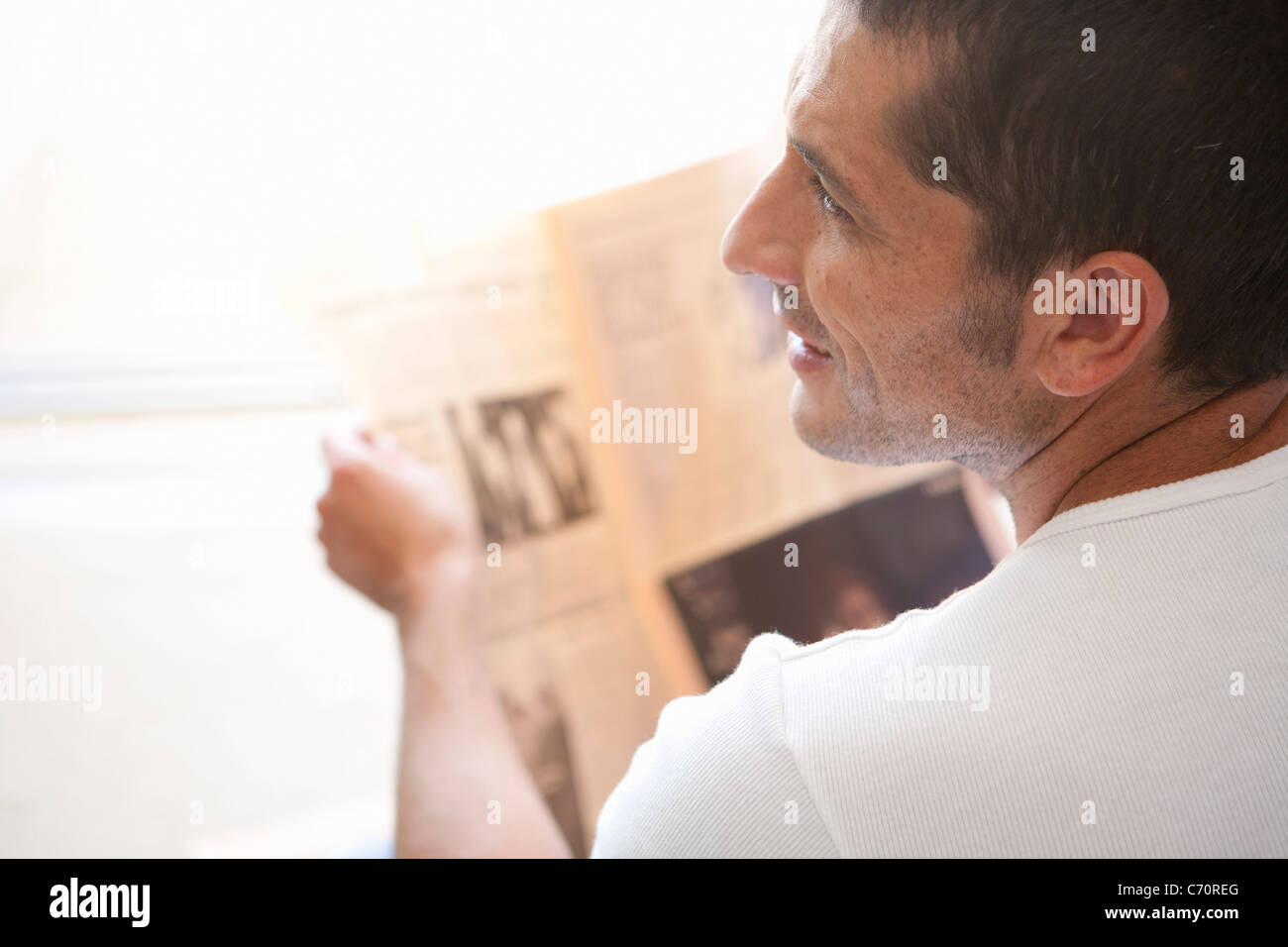 Man with newspaper over head hi-res stock photography and images - Alamy