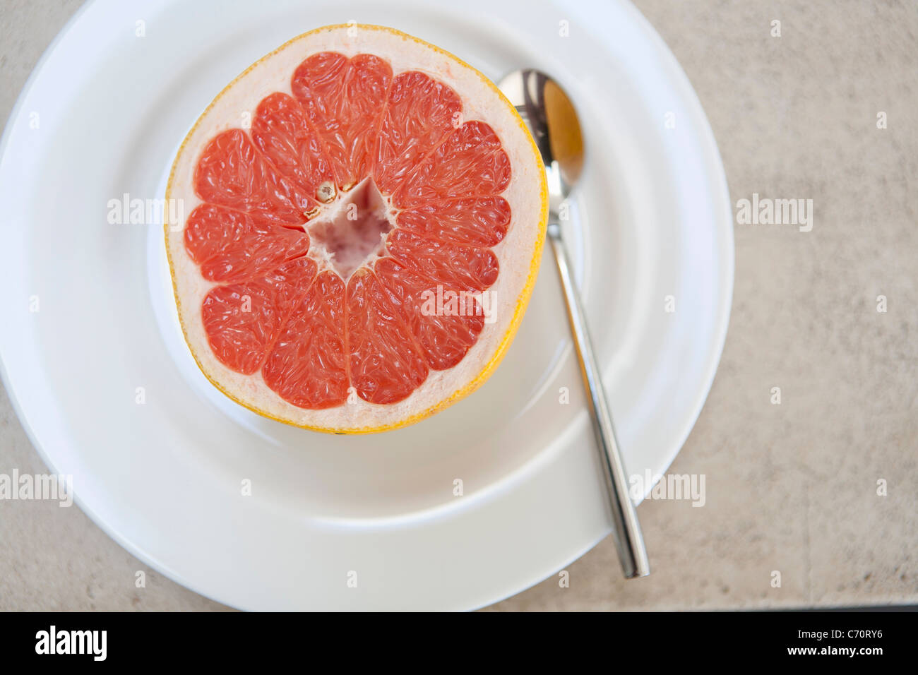 Close up of halved grapefruit Stock Photo - Alamy