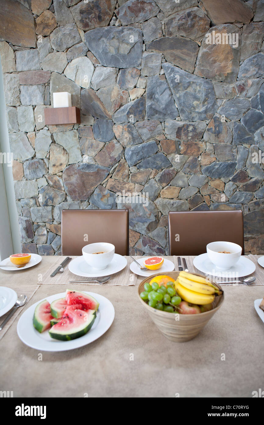 Place settings on breakfast table Stock Photo - Alamy