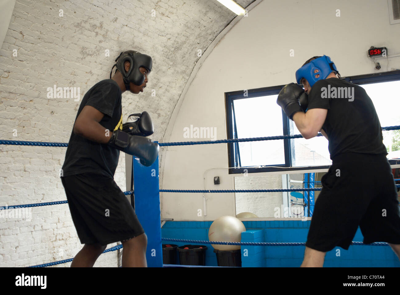 Boxers sparring in ring Stock Photo - Alamy