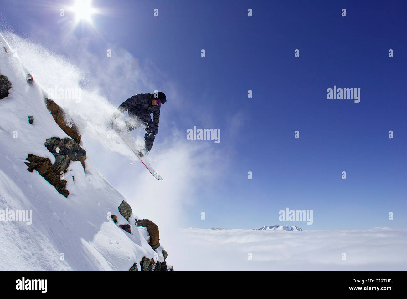 Snowboarder descending from mountain hi-res stock photography and ...