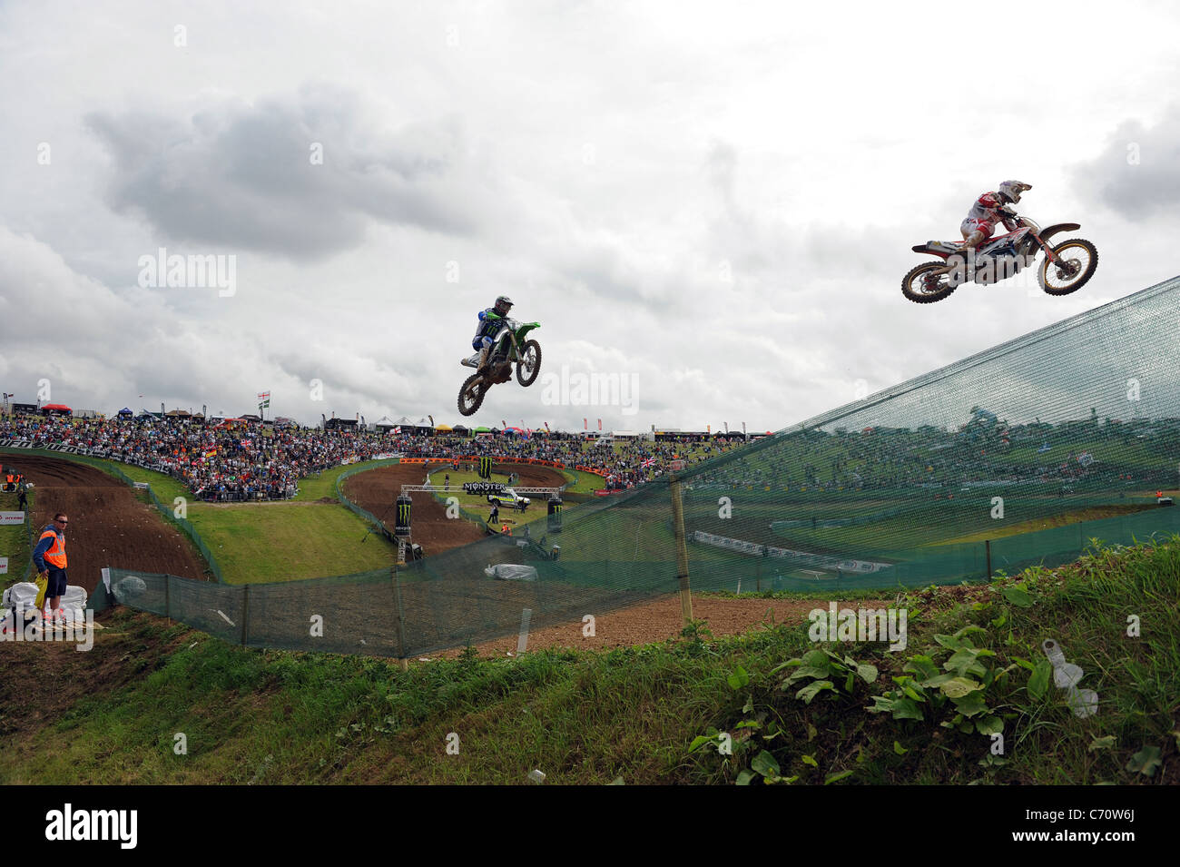 Motocross Racers jump through the air on MX Bikes Stock Photo - Alamy