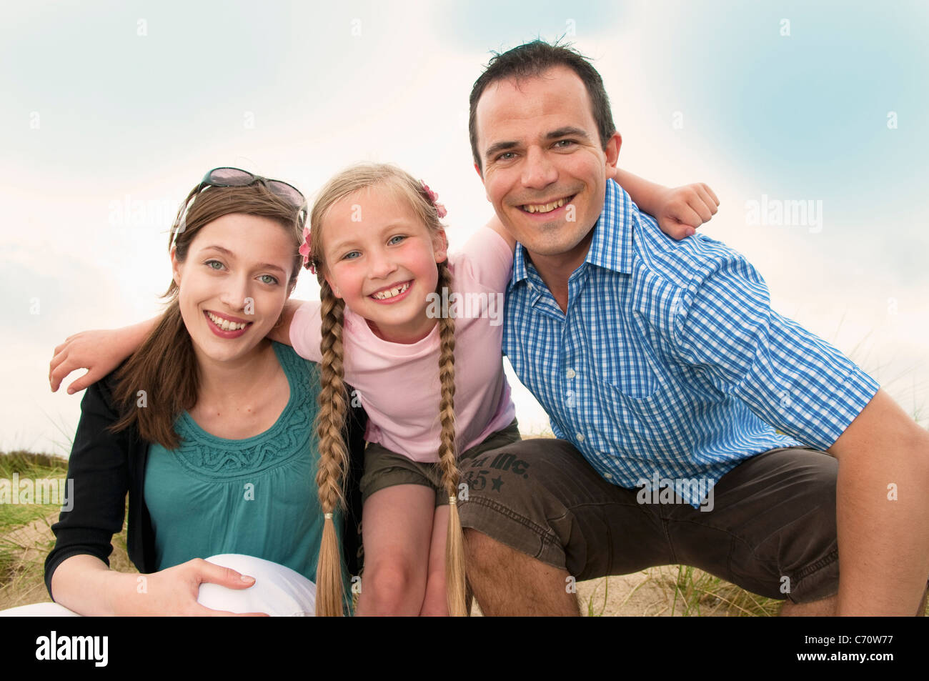 Family smiling together outdoors Stock Photo - Alamy