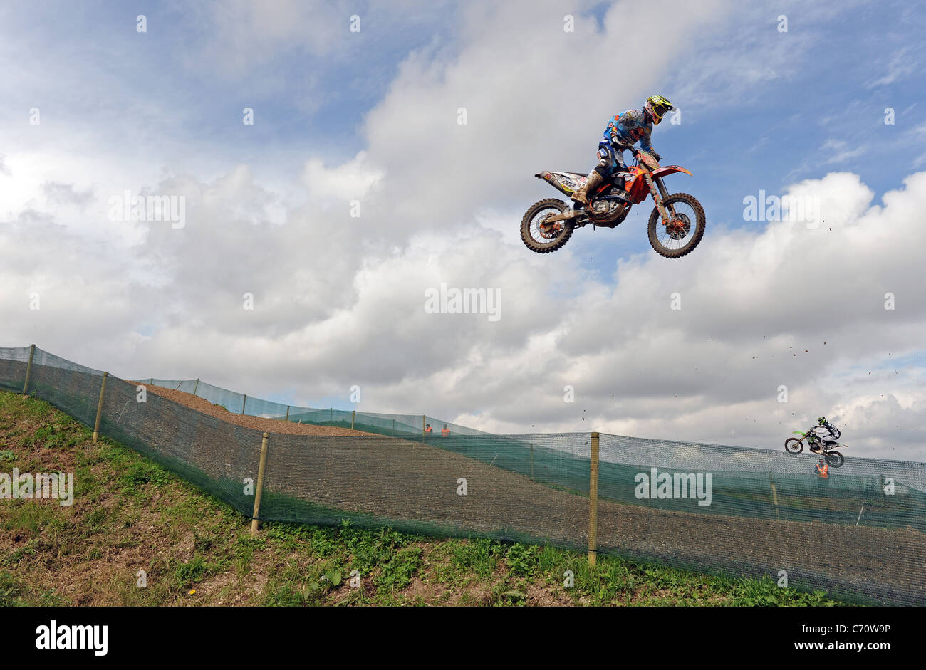 A Motocross Rider jumps through the air on an MX Bike Stock Photo - Alamy