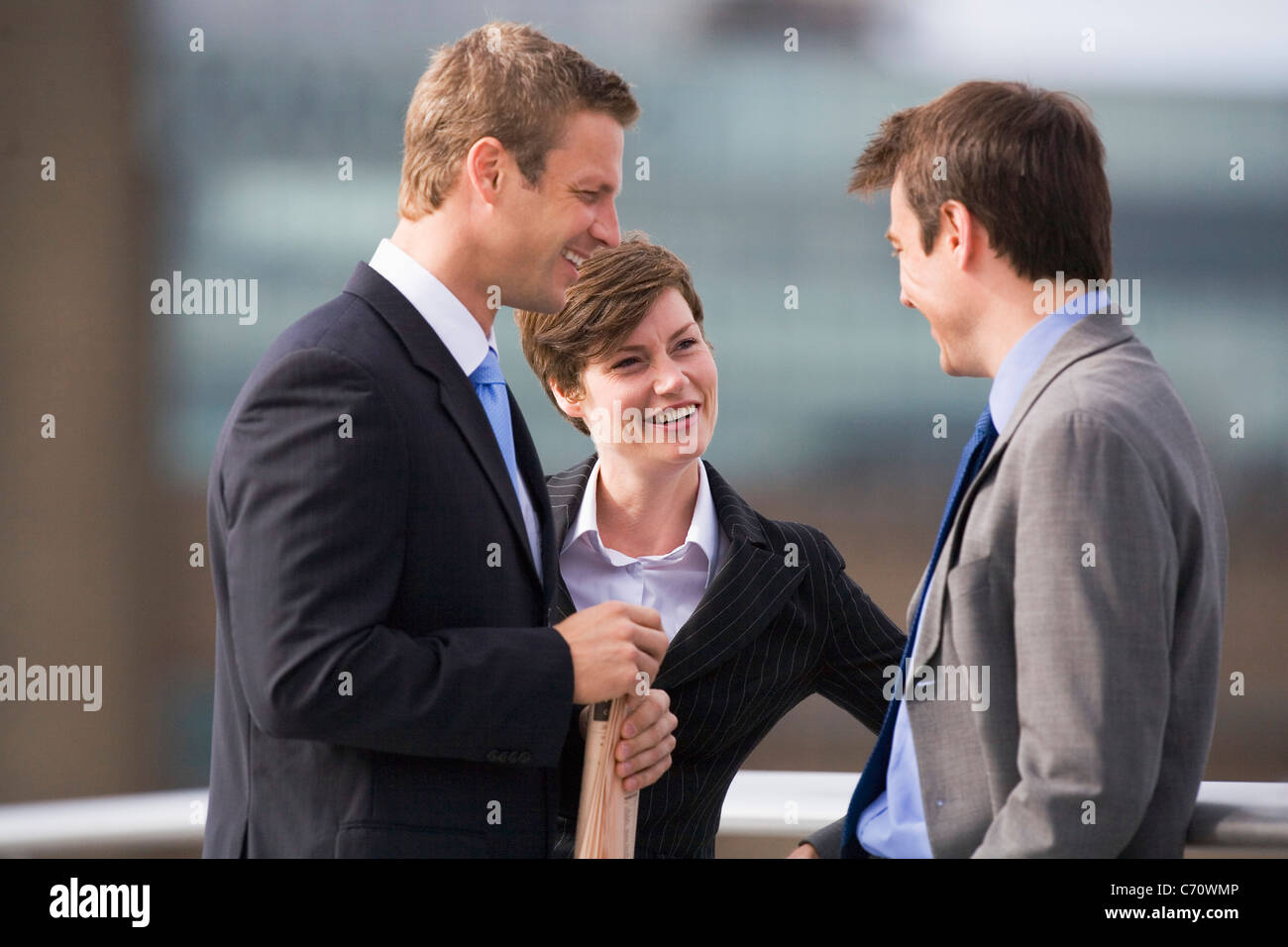 Business people talking outdoors Stock Photo - Alamy