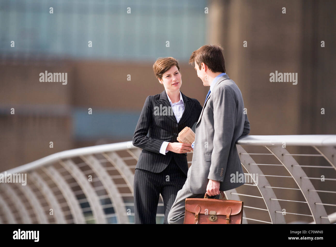 Business people talking outdoors Stock Photo - Alamy