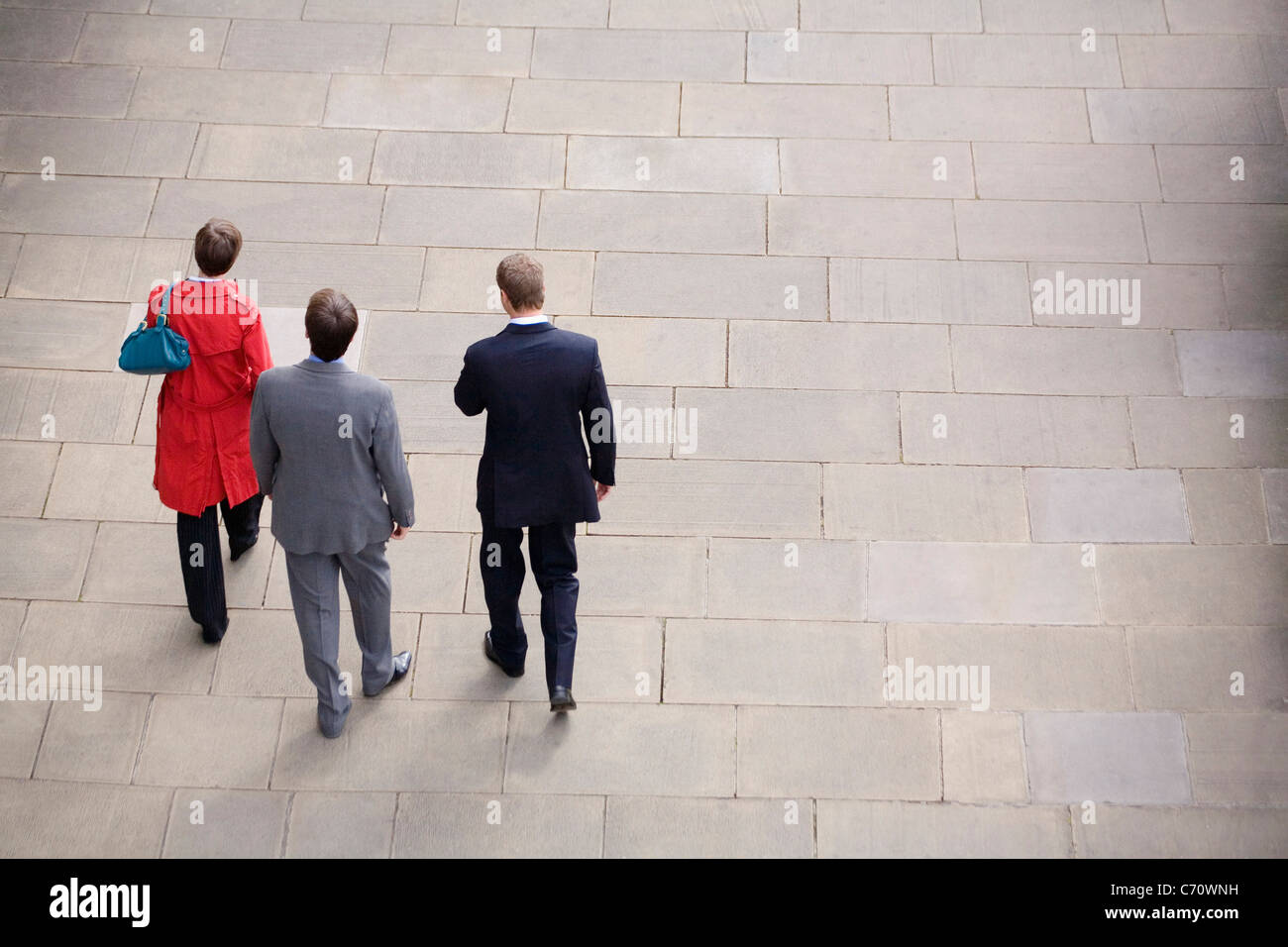 Business people walking in courtyard Stock Photo - Alamy