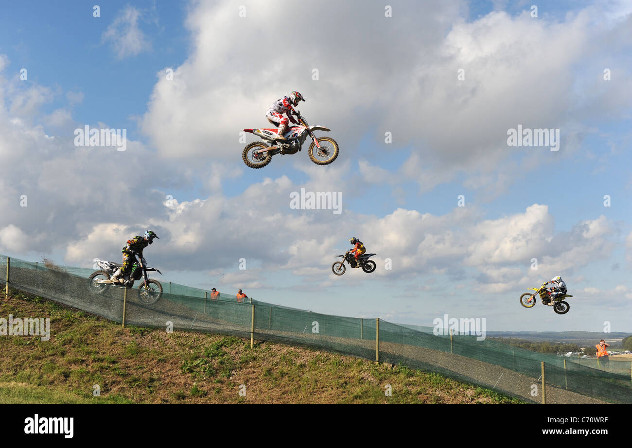 Motocross Racers jump through the air on MX Bikes Stock Photo - Alamy