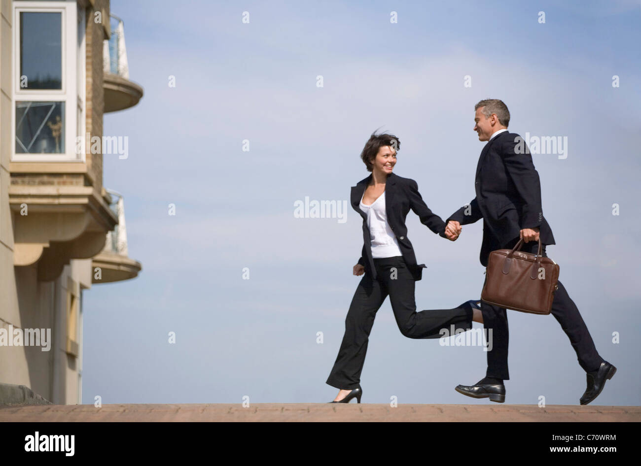 Business people running hi-res stock photography and images - Alamy
