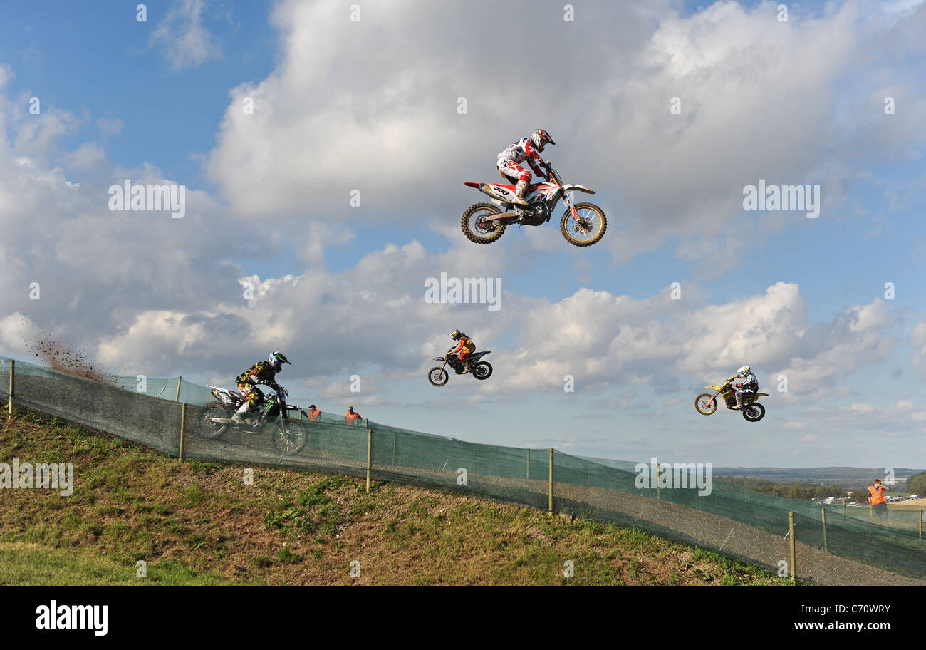 Motocross Racers jump through the air on MX Bikes Stock Photo - Alamy