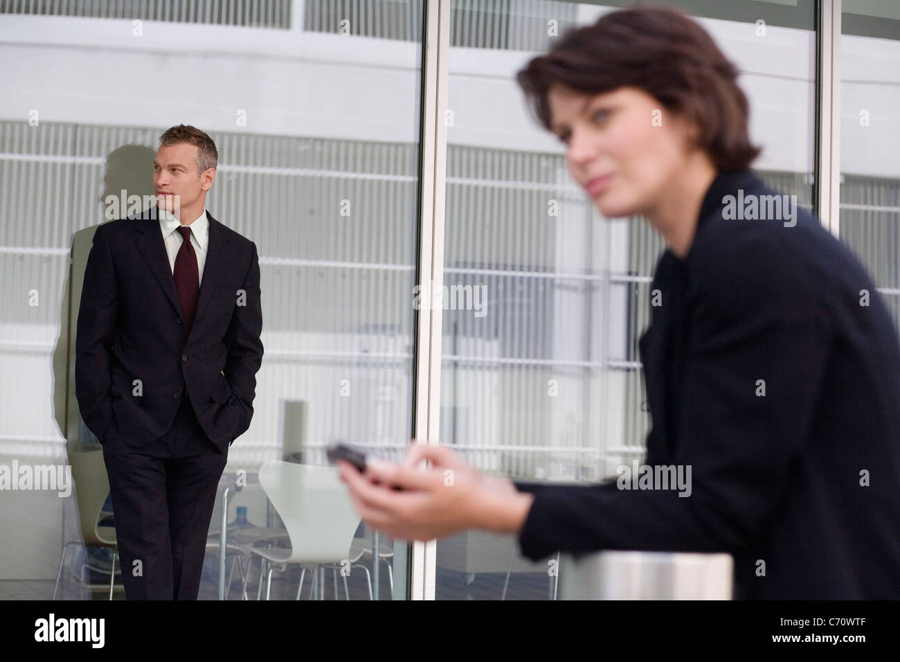 Businessman leaning on glass wall hi-res stock photography and images ...