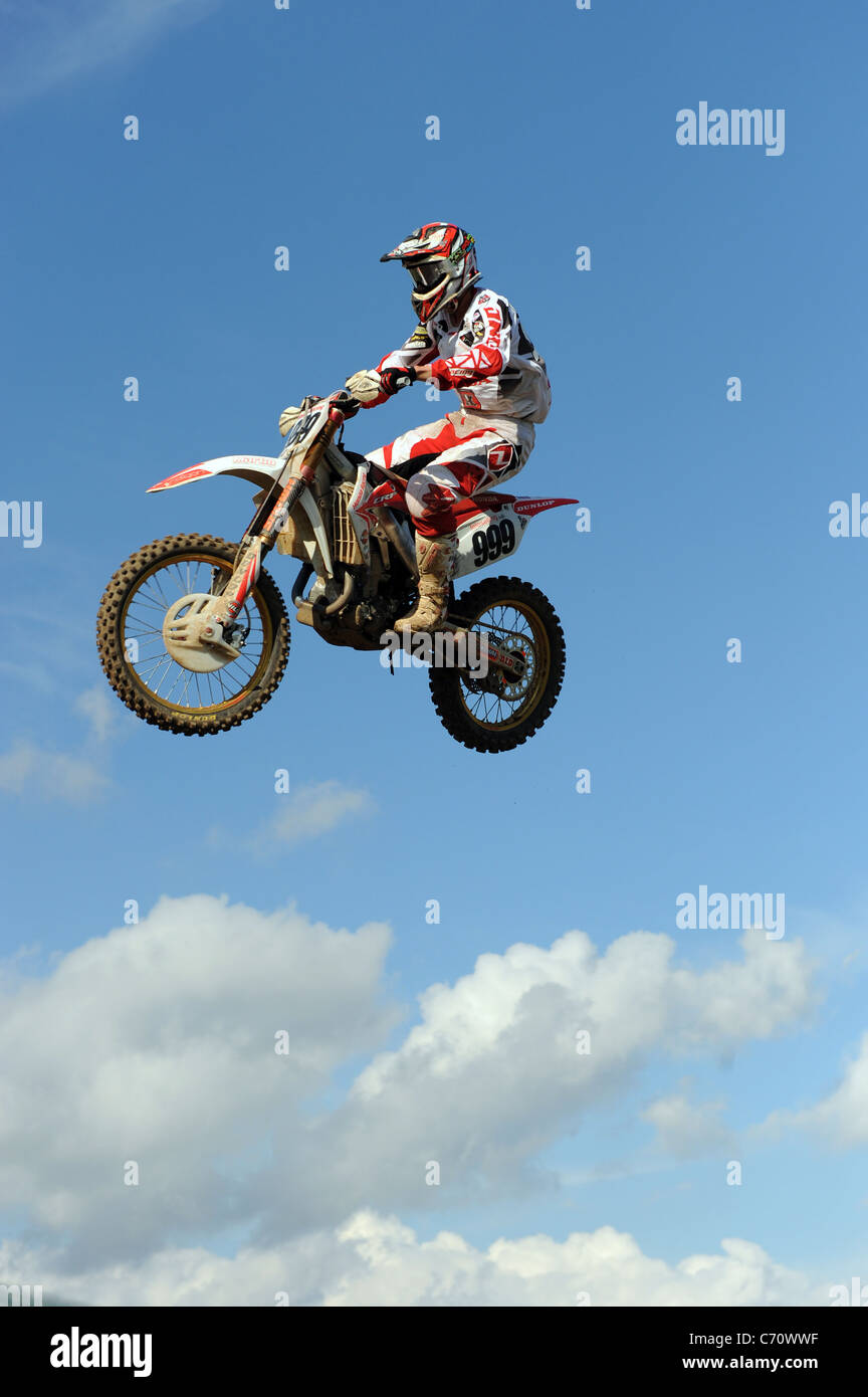 A Motocross Rider jumps through the air on an MX Bike Stock Photo - Alamy